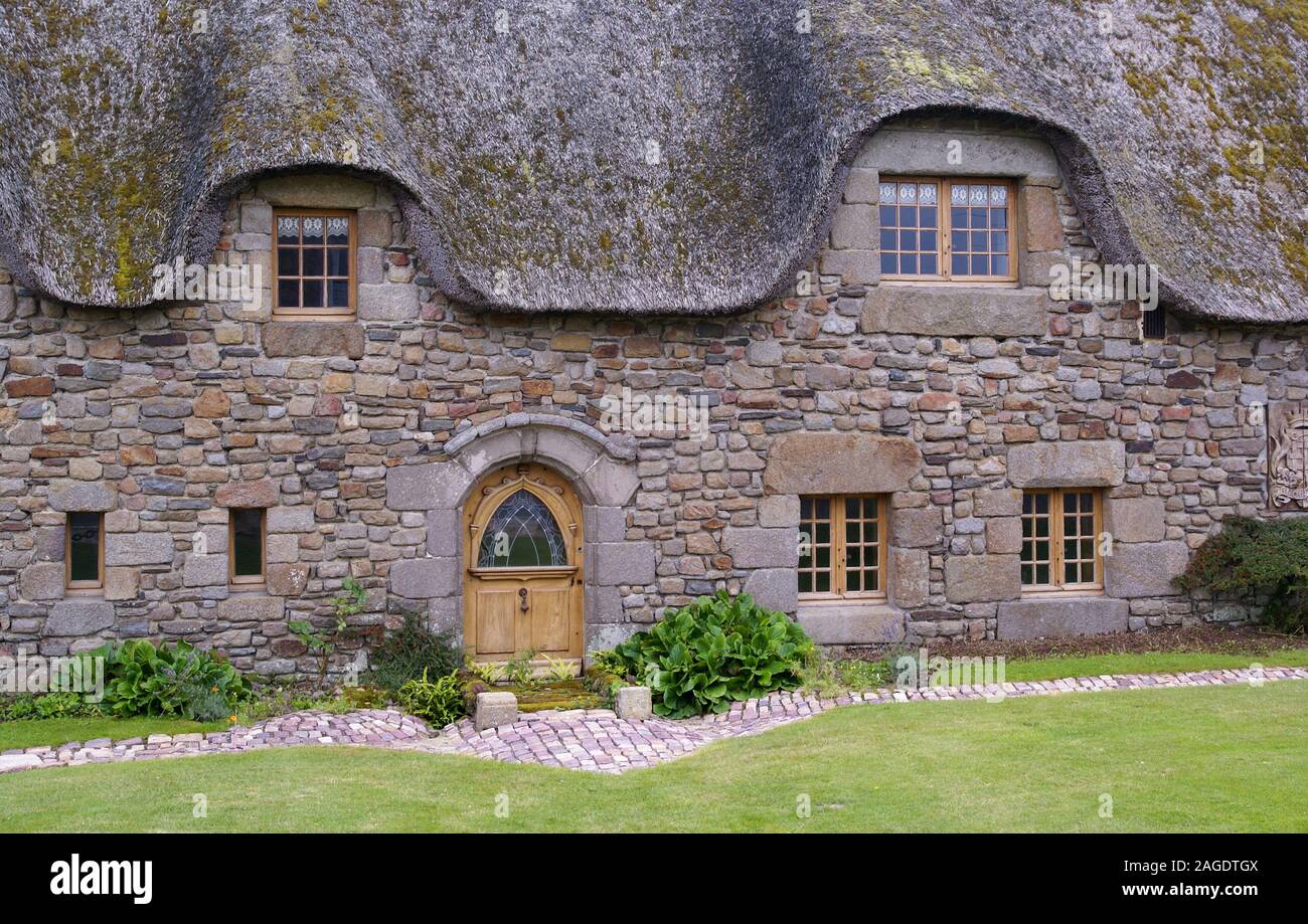 Entrance of an ancient farmhouse with wooden doors in Normandy, France ...