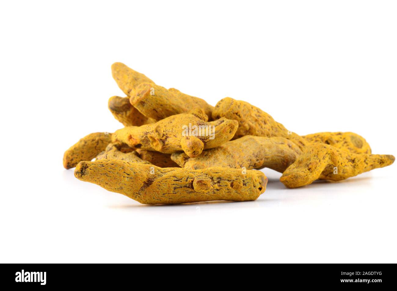 Dry Turmeric roots or barks isolated on white background Stock Photo ...