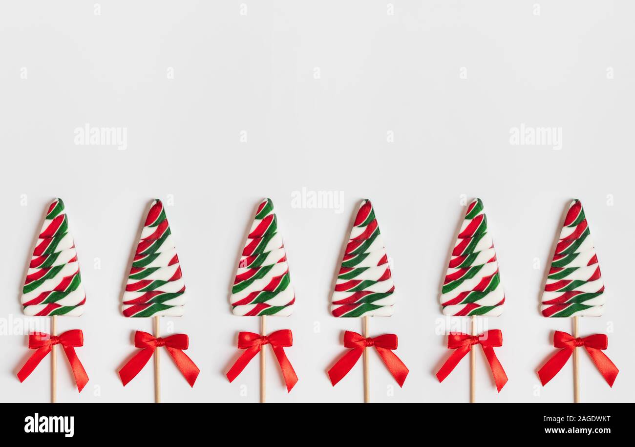 Christmas border with candy in the shape of a Christmas tree on a white ...