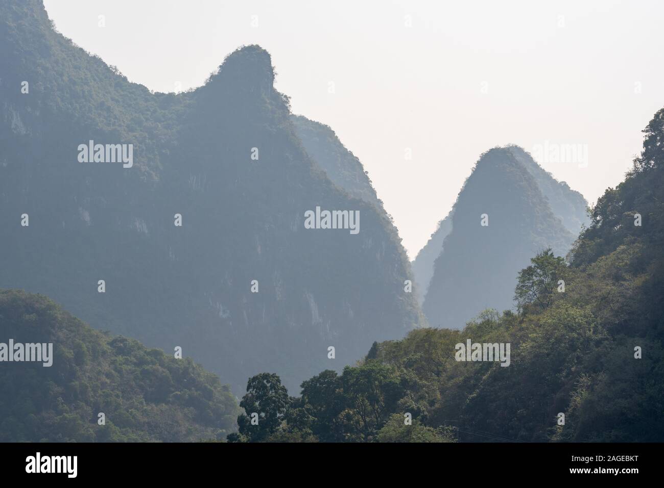 Karst formation and foggy limestone mountain landscape between Guiling ...