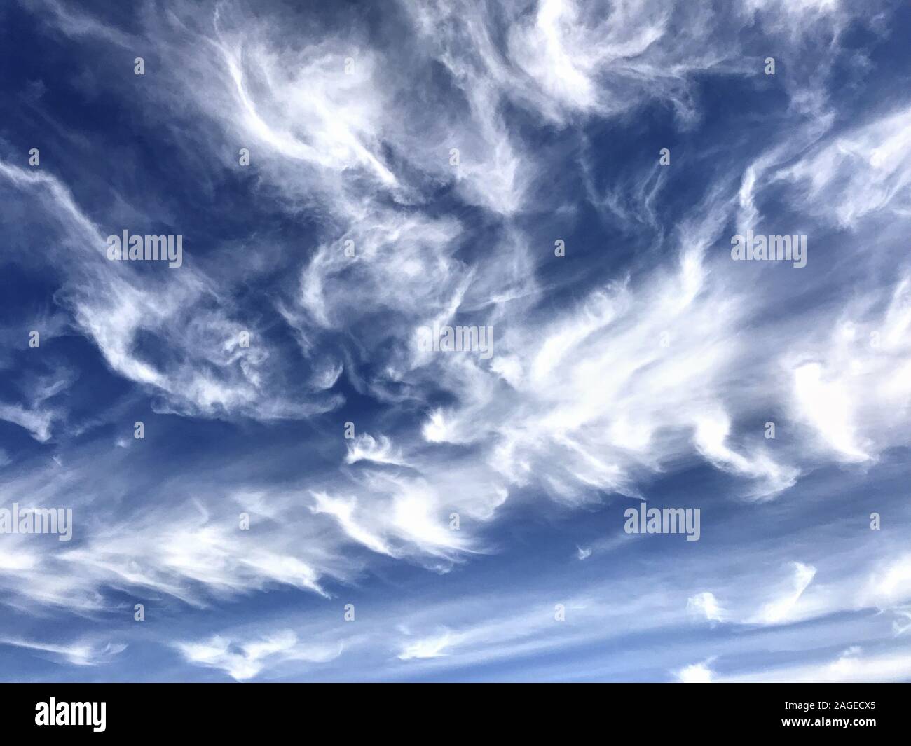 Breathtaking clouds making beautiful shapes in the blue sky Stock Photo ...