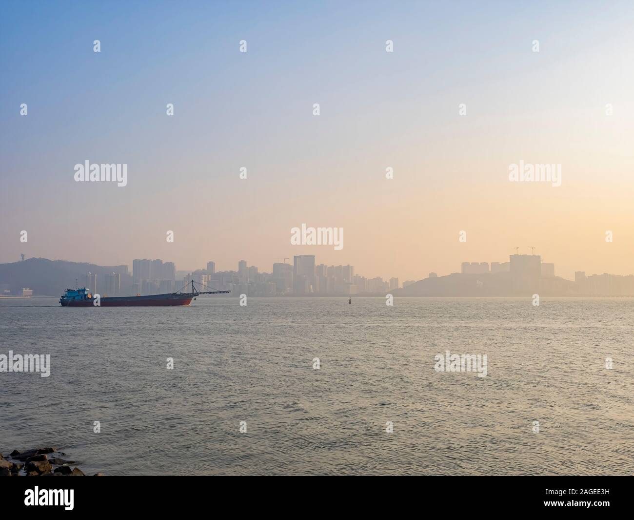 Afternoon view of a cargo ship and Taipa cityscape at Macau Stock Photo ...