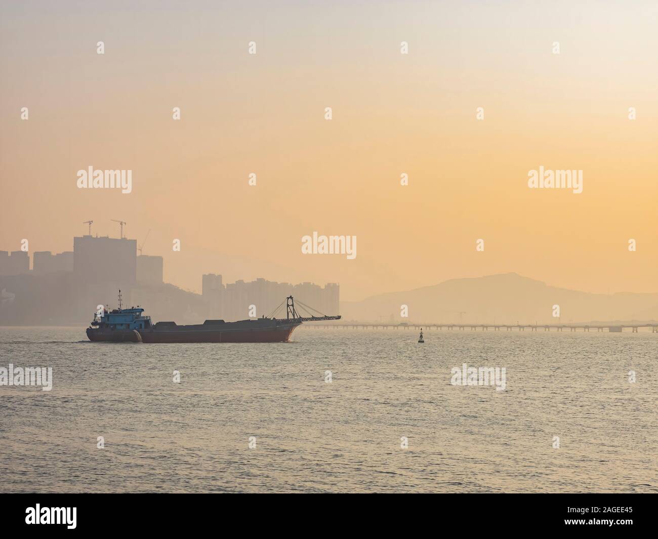 Afternoon view of a cargo ship and Taipa cityscape at Macau Stock Photo ...