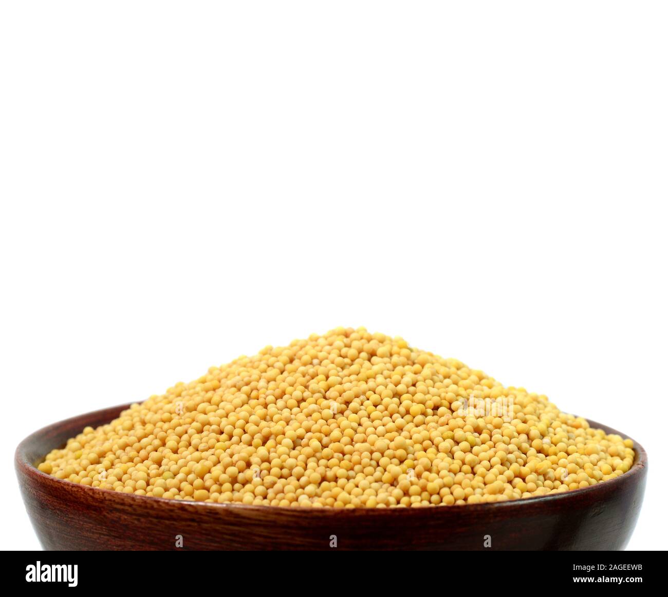 yellow mustard seeds in wooden bowl isolated on white background Stock ...