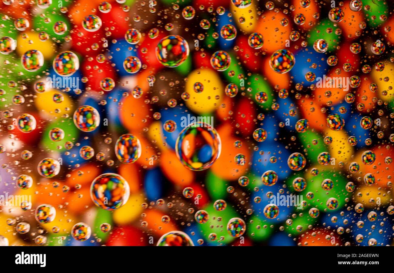 Cool background of colorful sweet candy under the glass covered with ...