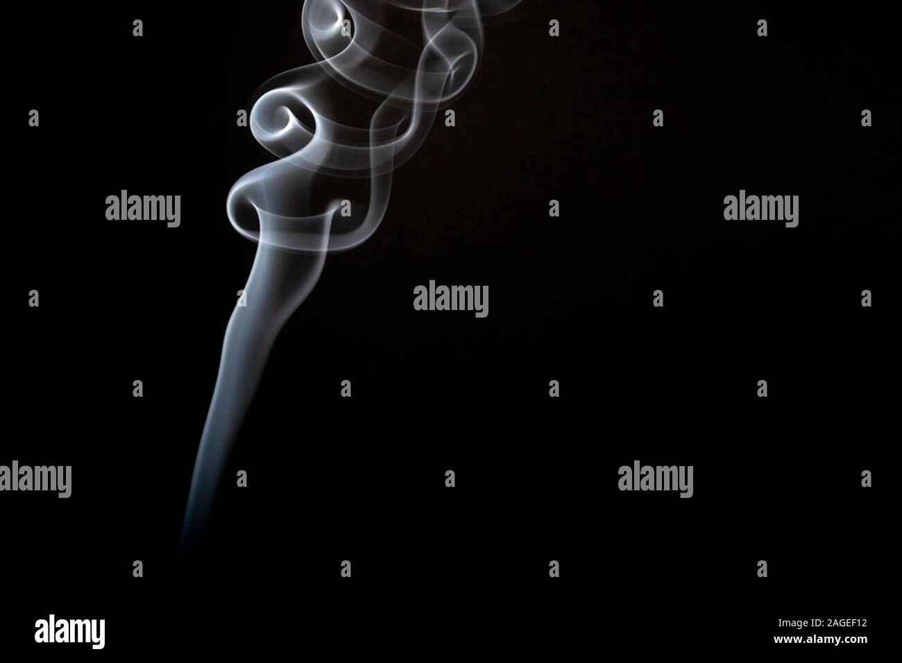 Realistic shot of a wisp of smoke against a black background - great ...