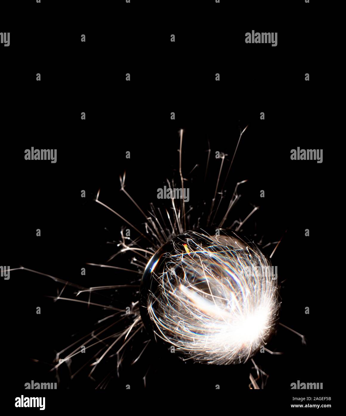 Crystal ball with burning sparklers on a black background - great for a ...