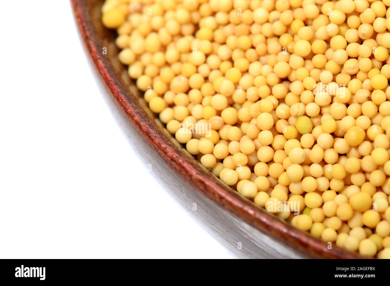 yellow mustard seeds in bowl isolated on white background Stock Photo ...