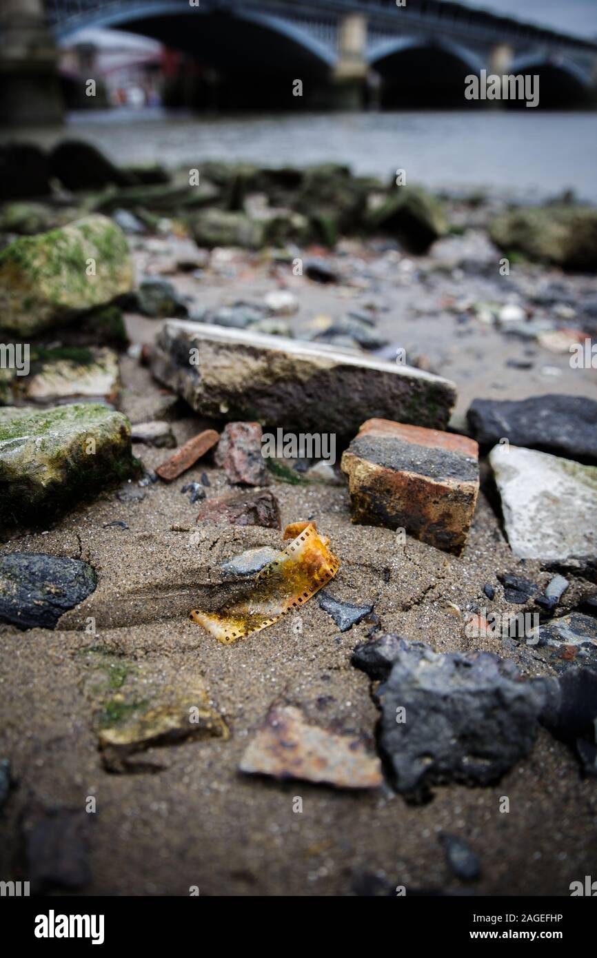 Vertical shot of the small sharp stones located at the shore of the ...