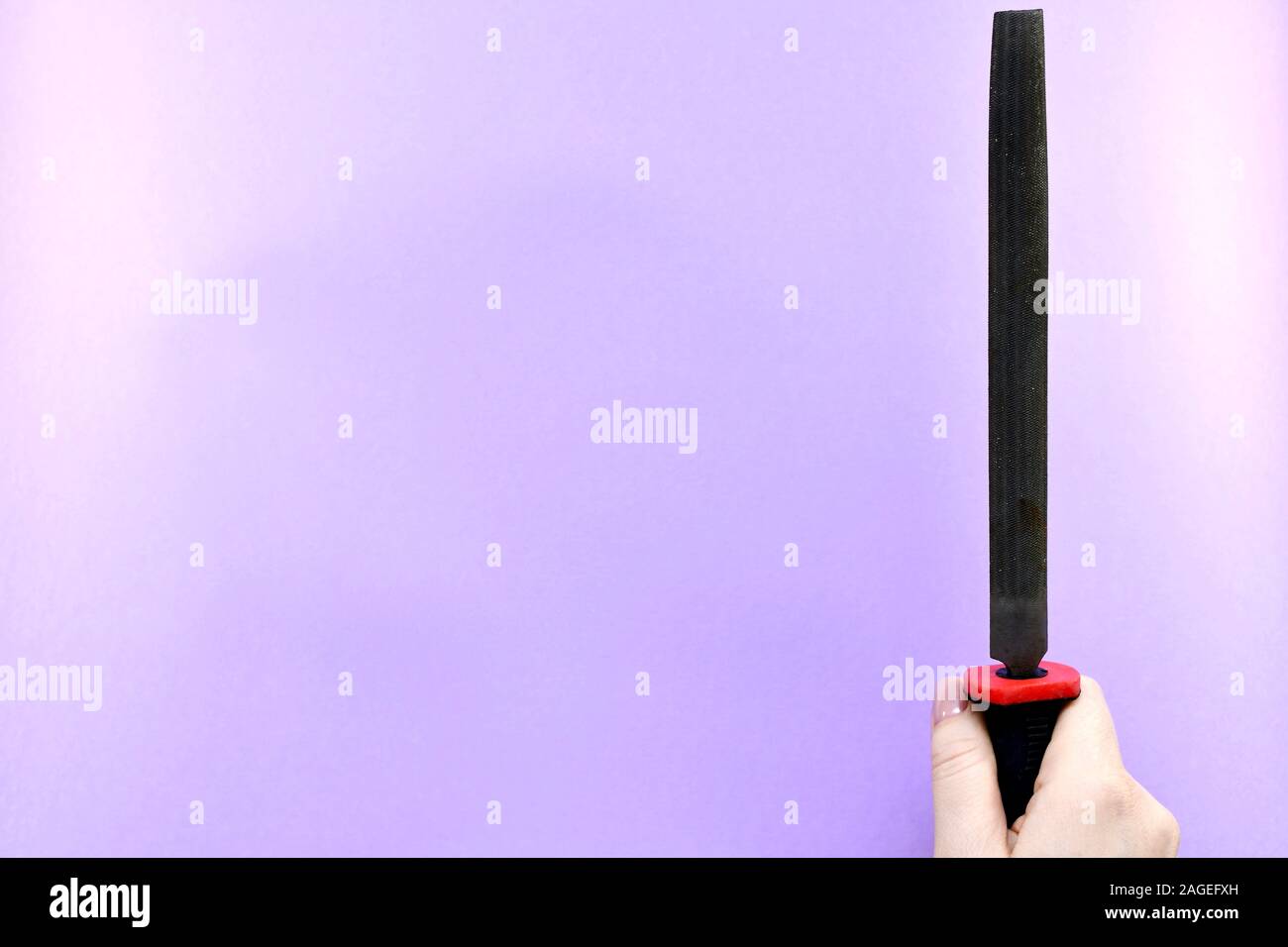 The file is sandwiched with the back of the palm, pointing upwards ...