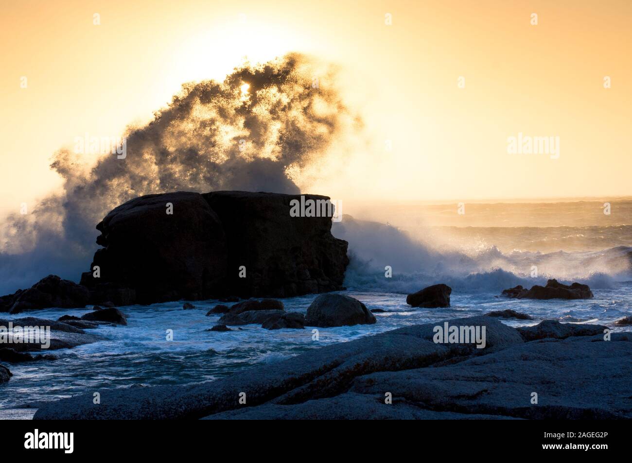 Beautiful view of the sea waves hitting a big stone near the beach ...