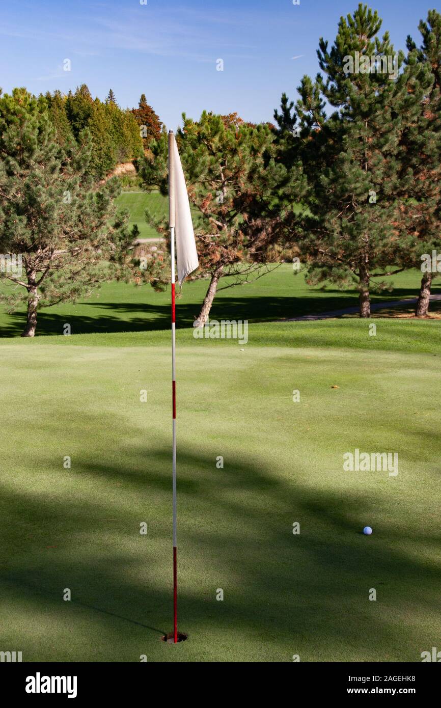 landscape fall foliage at Golf Course flag in hole at front Stock Photo ...