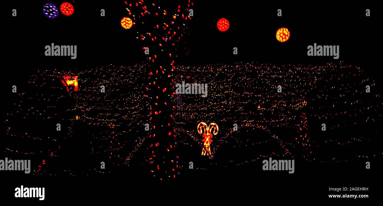 Dark background with colorful lamp lights and Christmas decorations - a ...