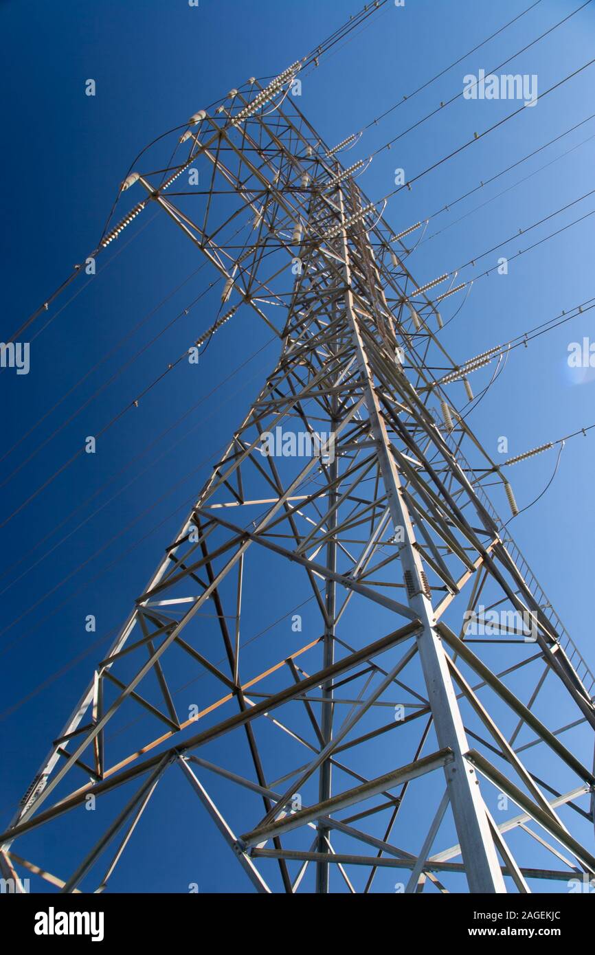 tower of electrical high voltage power on blue sky Stock Photo - Alamy