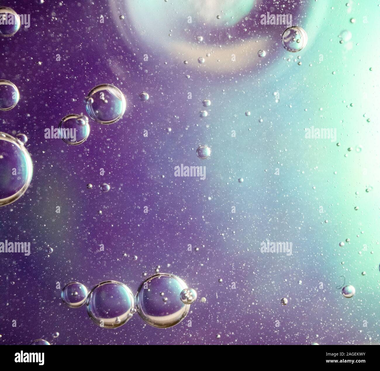 Beautiful shot of soap bubbles on a purple background with interesting ...