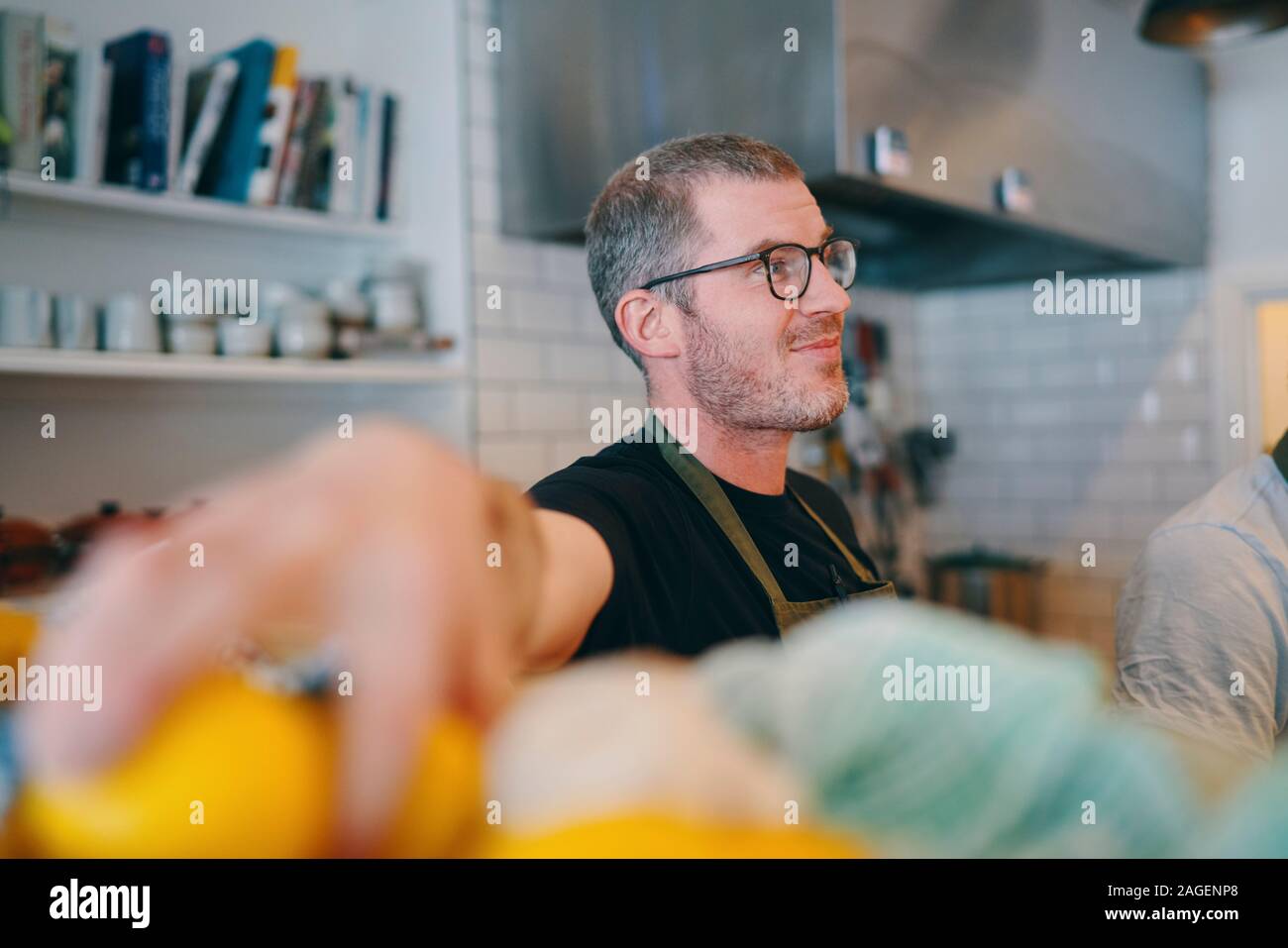 Male staff working behind counter hi-res stock photography and images ...