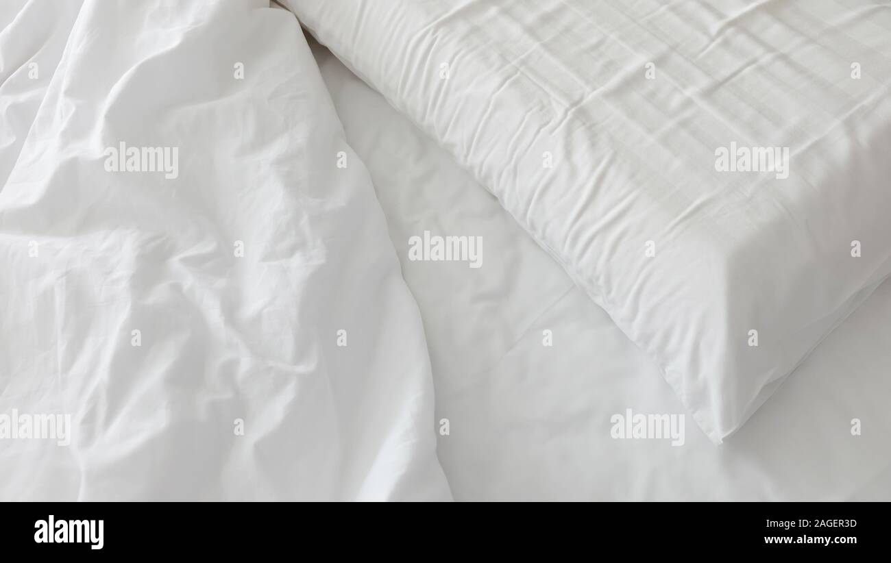 White linen, duvet, and pillow with creases Stock Photo - Alamy