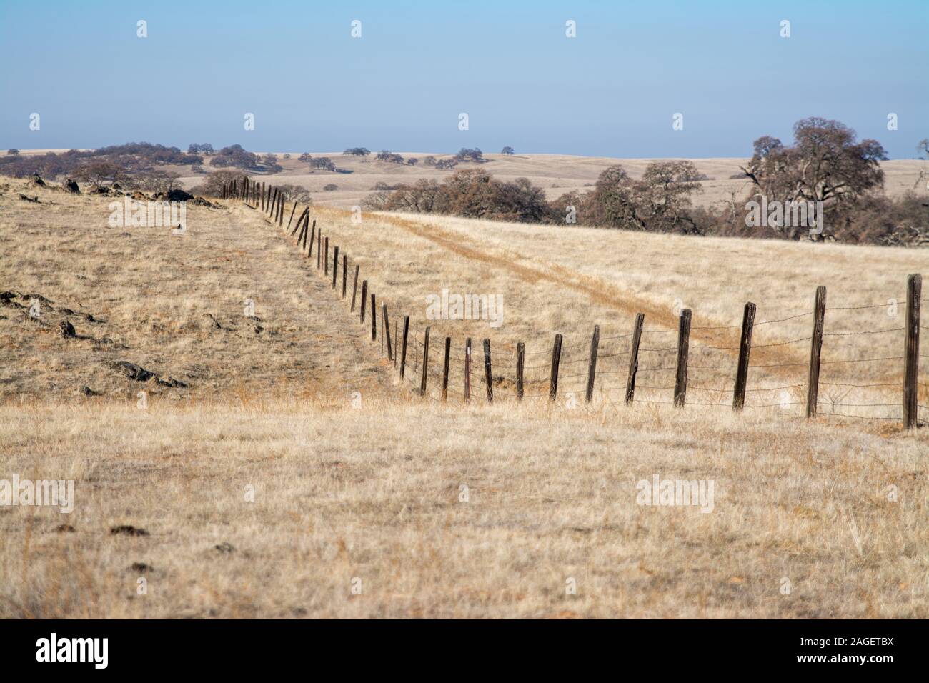 old wood post fence with wire cattle pasture Stock Photo - Alamy
