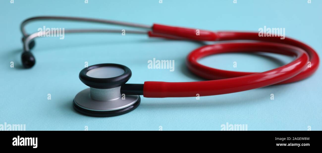 Red doctor stethoscope on blue modern background Stock Photo - Alamy