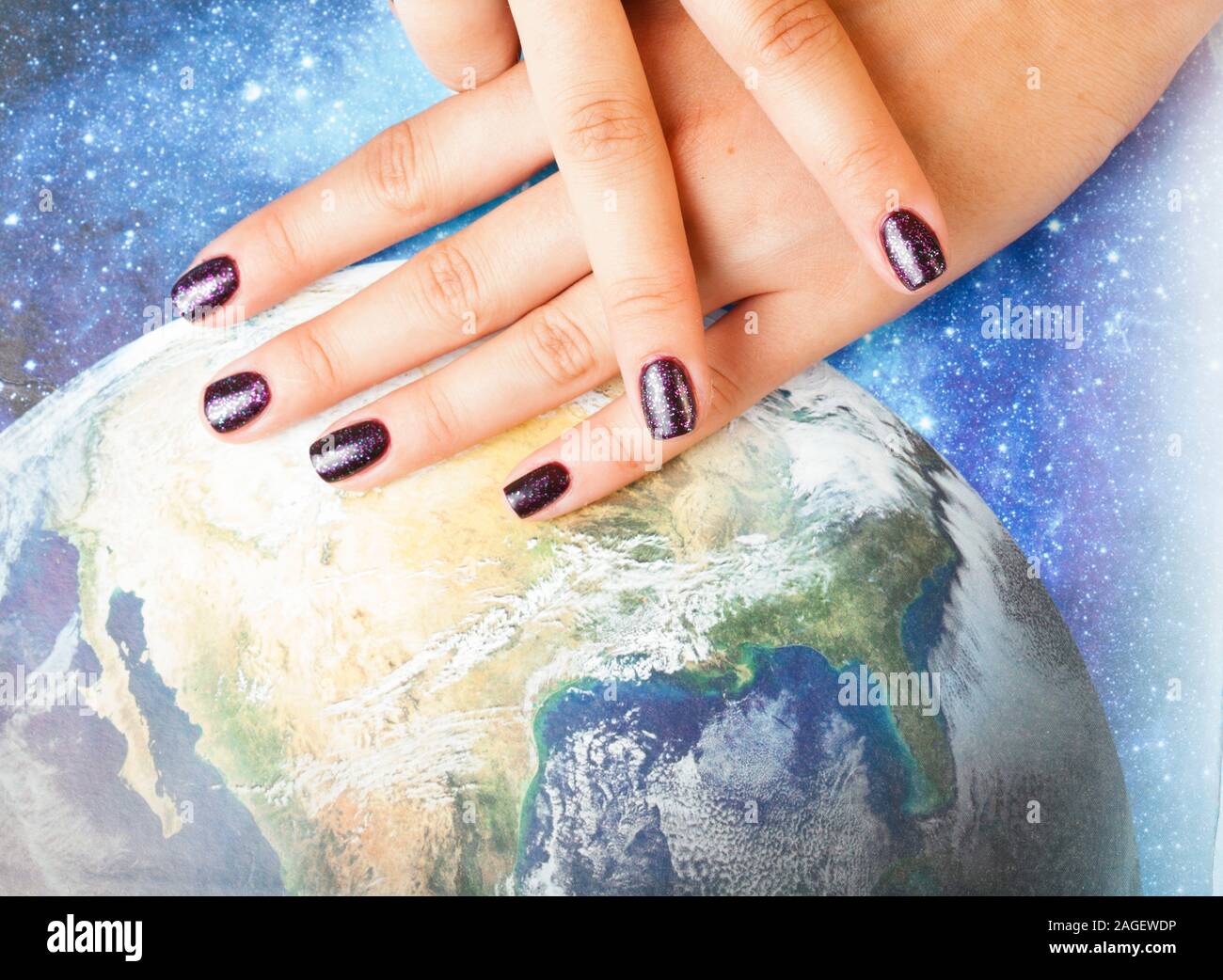 woman hands with purple manicure holding Earth ball, global planet ...