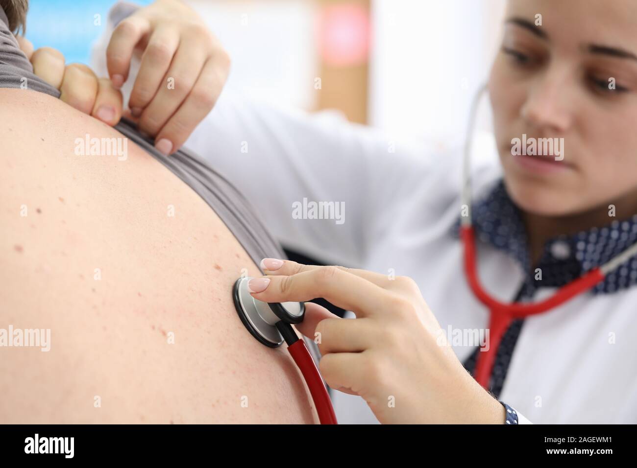 Nurse listening to breathing Stock Photo - Alamy