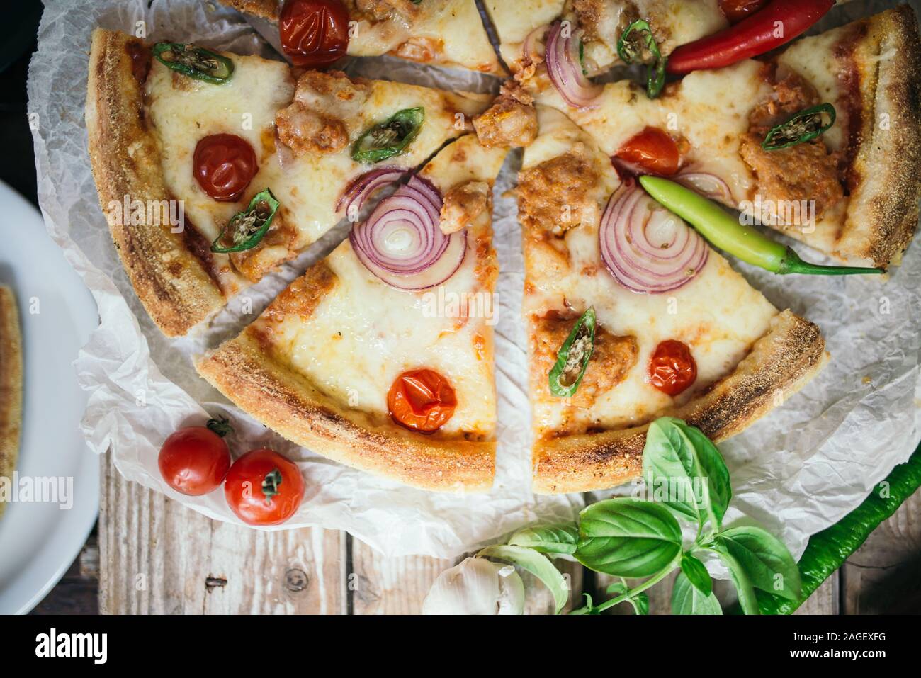 Creative Italian pizza with pepperoni and cherry Stock Photo - Alamy