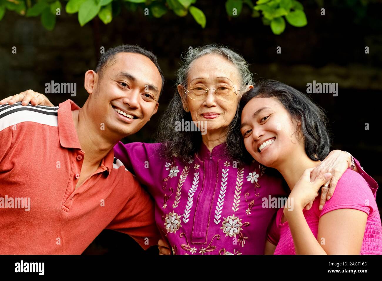 Portrait of happy Southeast Asian family gather together. Young adult ...