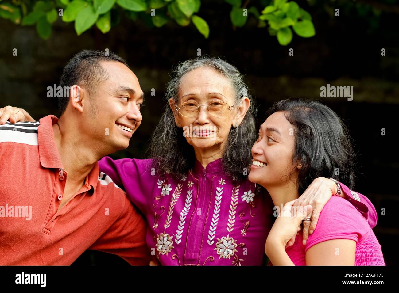 Portrait of happy Southeast Asian family gather together. Young adult ...