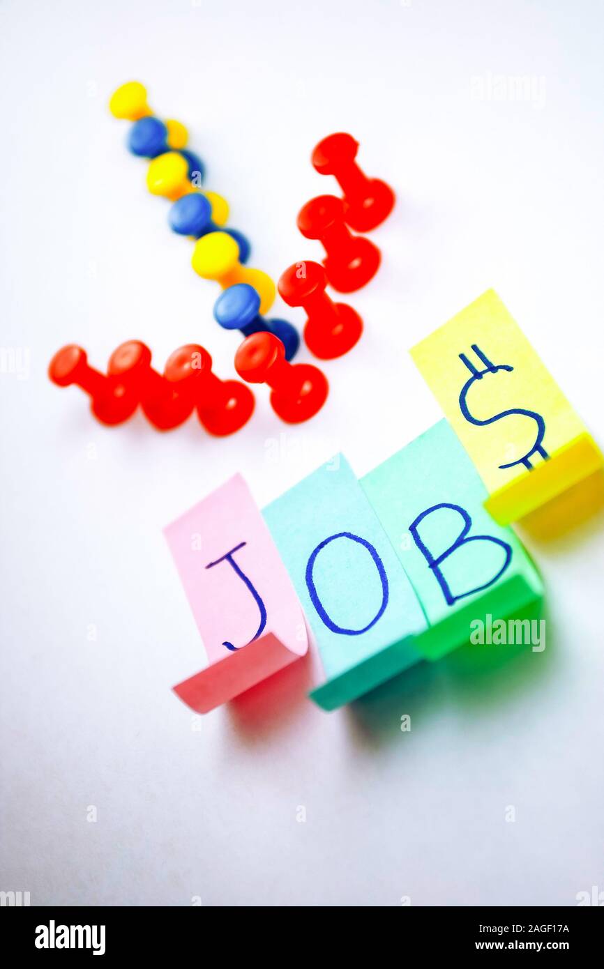 Colorful push pins in arrow shape pointing toward jobs word. Concept ...