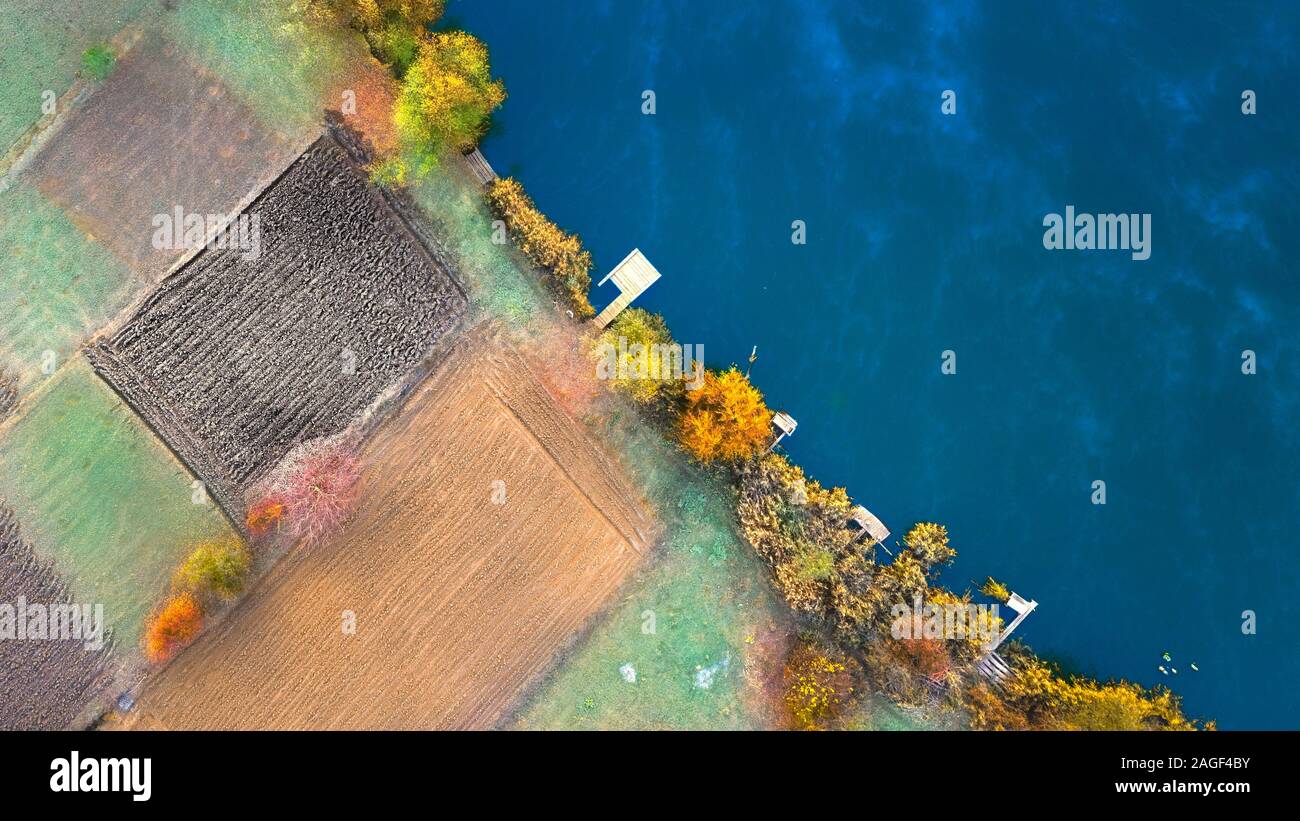 coastline with empty garden plots and yellow autumn trees Stock Photo ...
