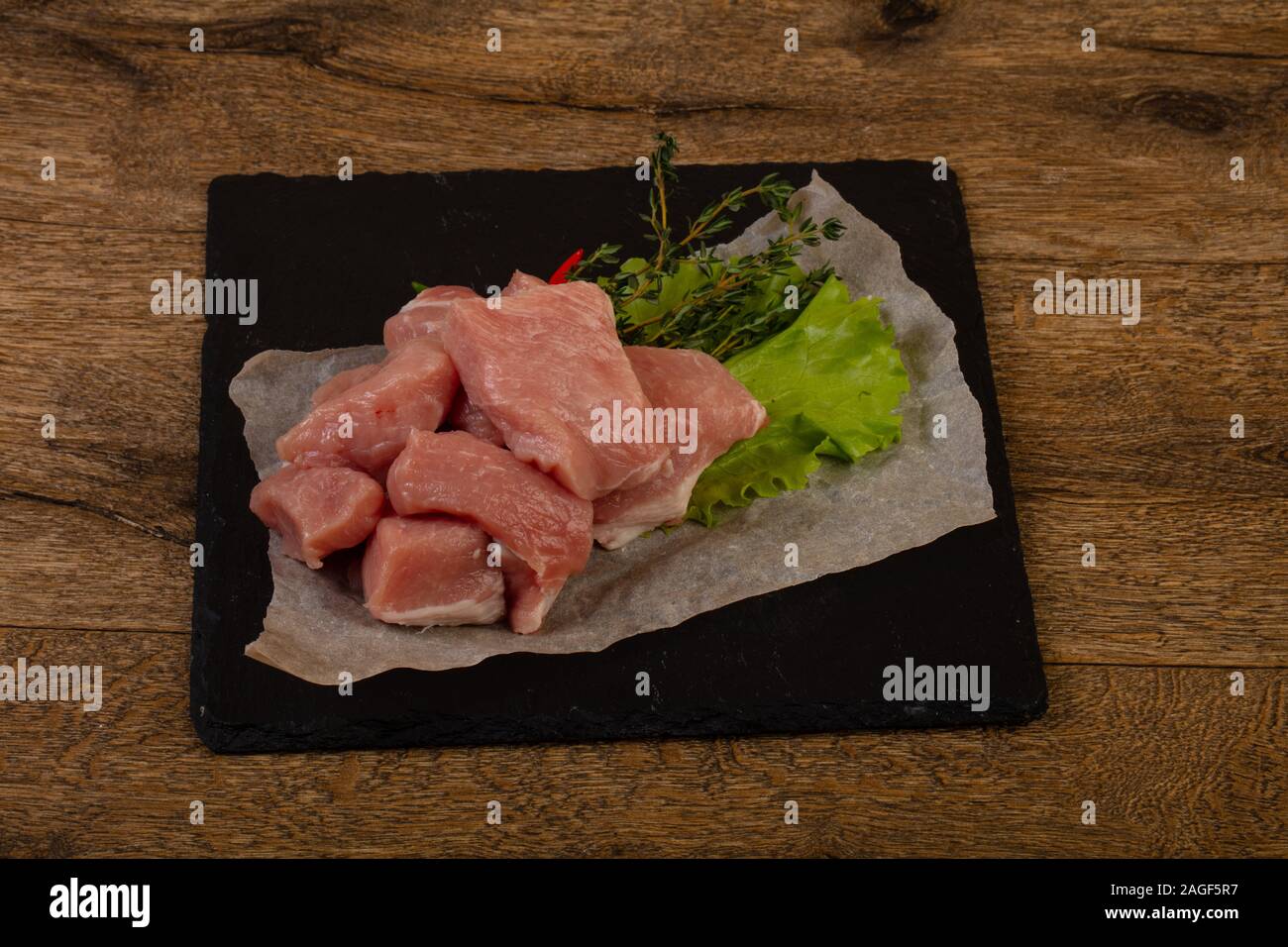 Raw pork meat heap for roast Stock Photo - Alamy