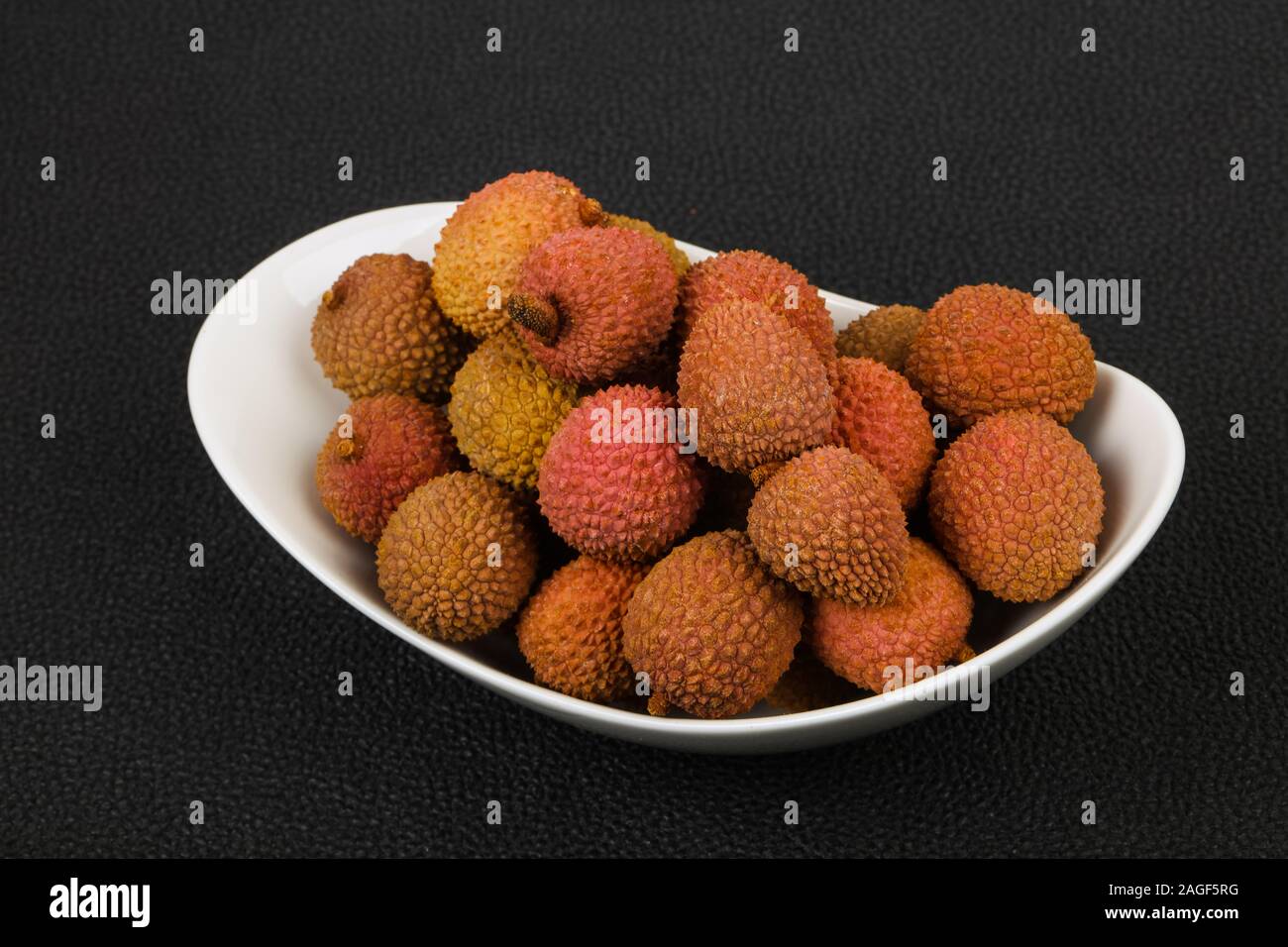 Tropical fruit lychee in the bowl Stock Photo - Alamy