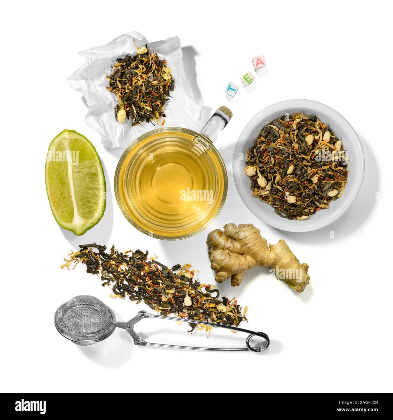 Green tea with aromatic additives and accessories. Top view on white ...