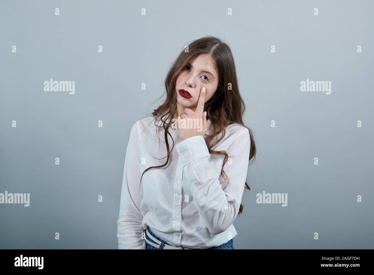 Fingers on cheek hi-res stock photography and images - Alamy