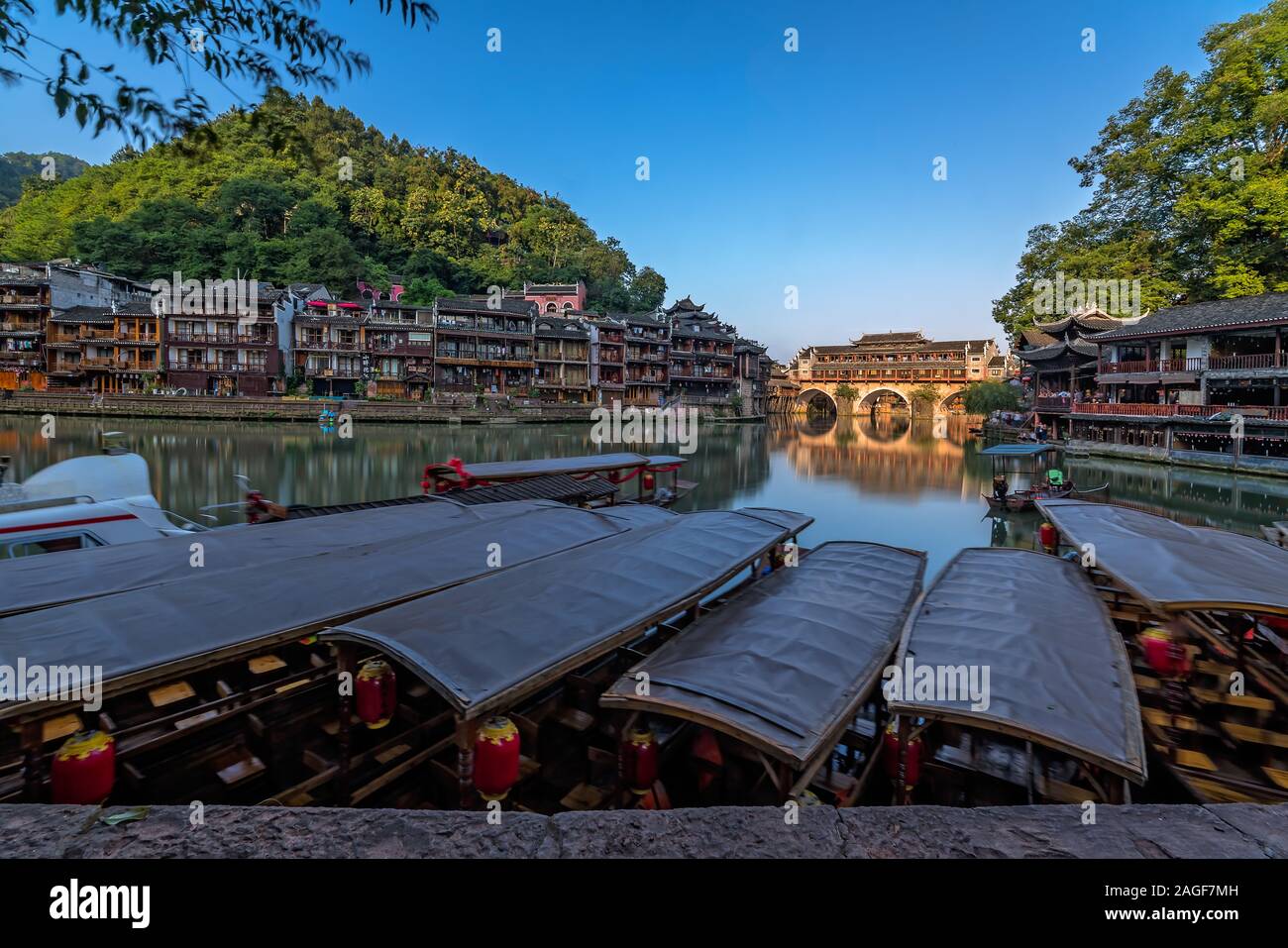 Old historic wooden tourist boats on the riverbanks of Tuo river ...