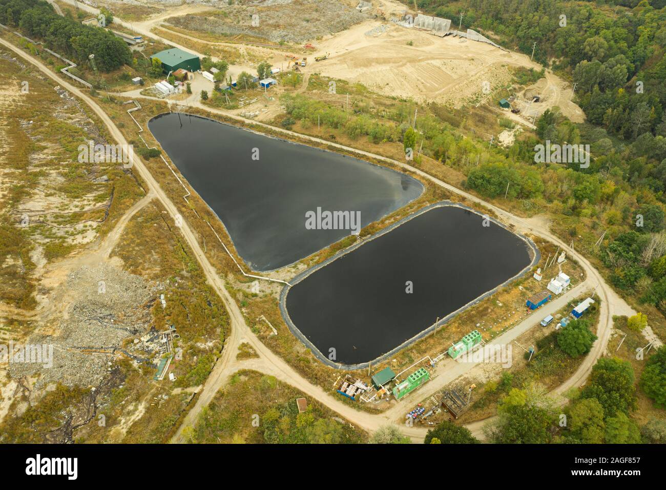 Dirty water tank near the landfill. Treatment plant Stock Photo - Alamy
