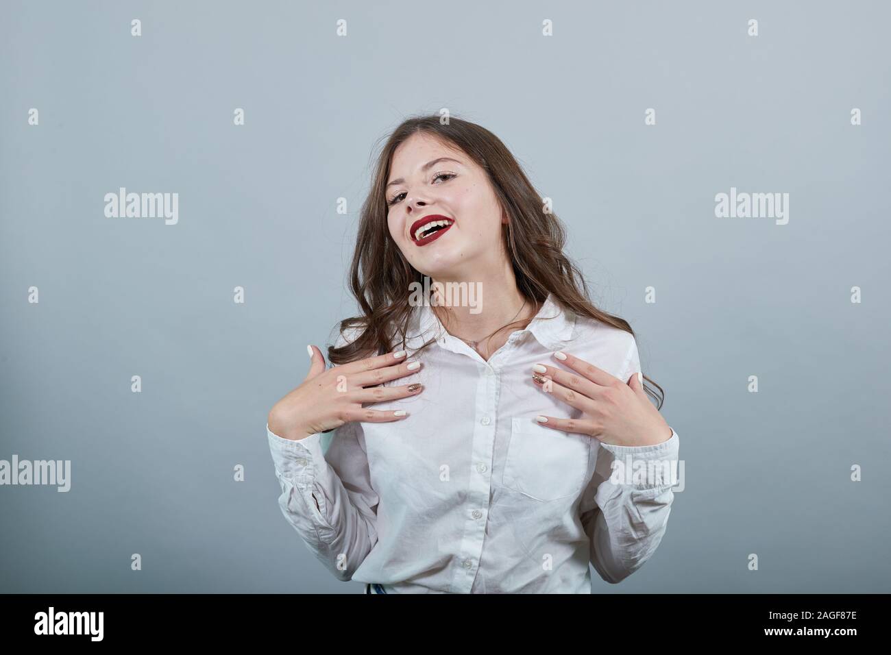 Woman Holding Hands To Chest High Resolution Stock Photography and ...