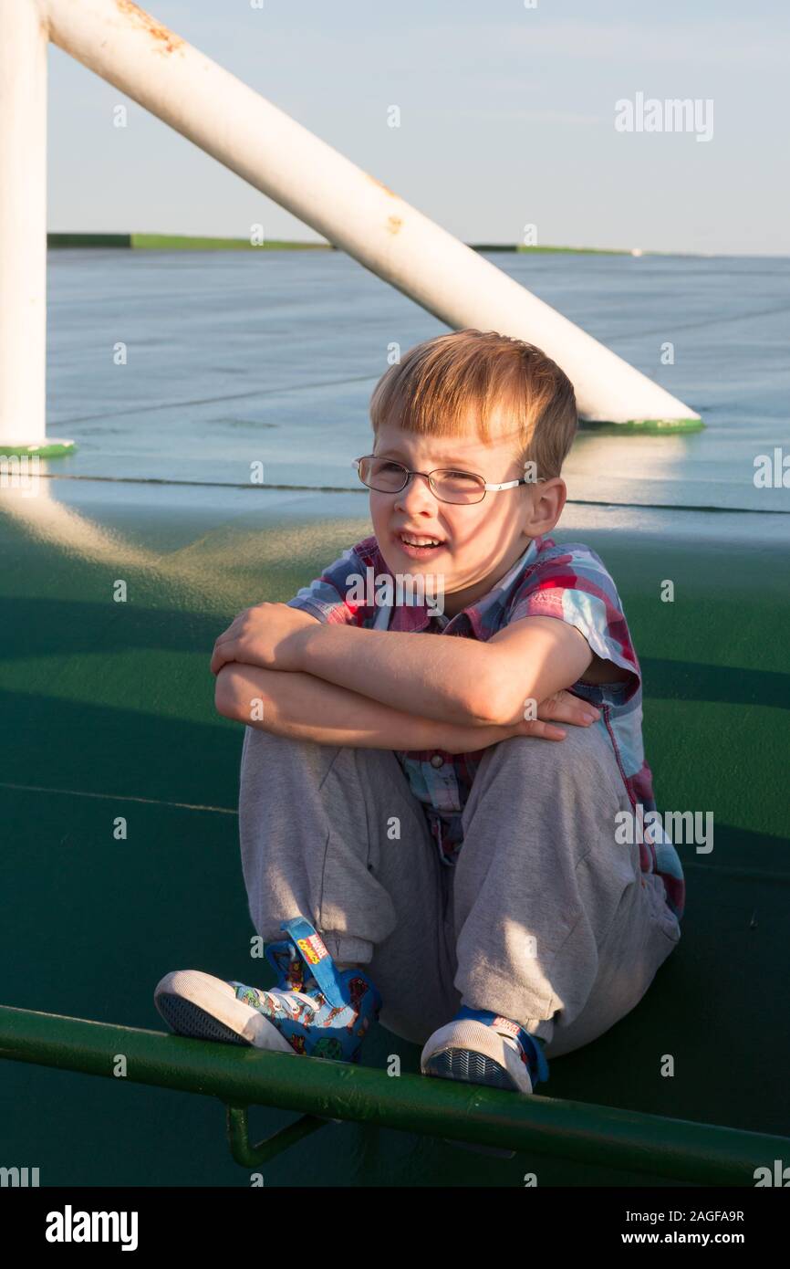 Cute young boy smiling widely Stock Photo - Alamy