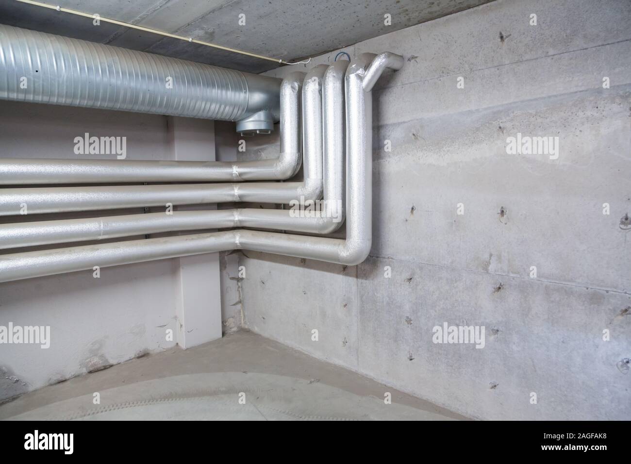 Pipes on a wall Stock Photo - Alamy