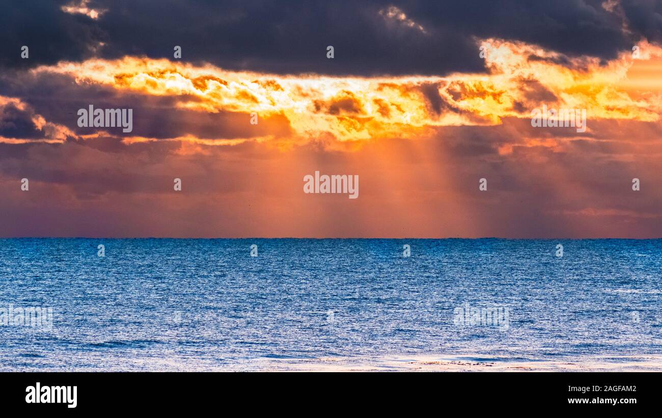 Fiery sunset through storm clouds hi-res stock photography and images ...