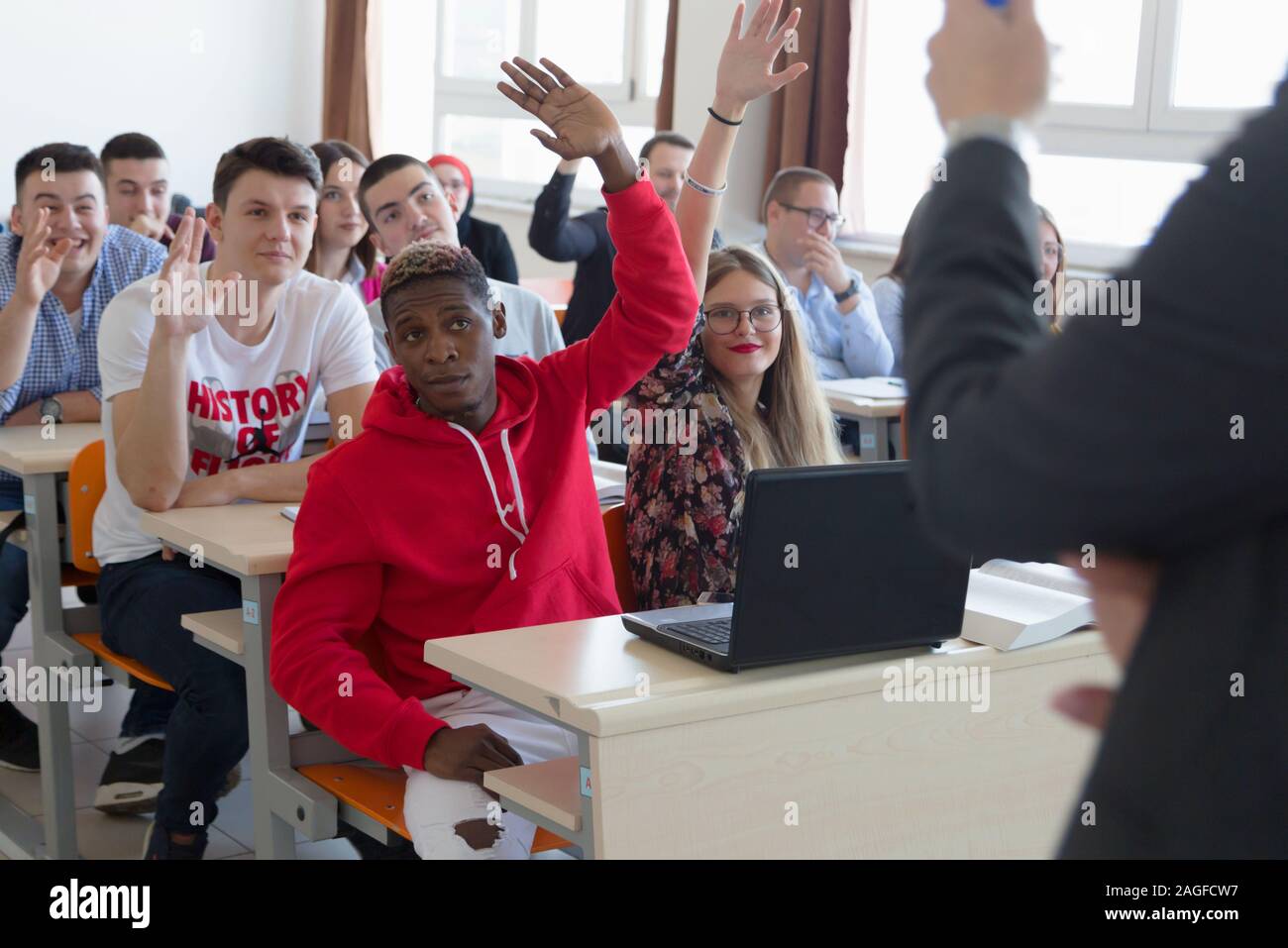 Female attractive professor explain lesson to students and interact ...