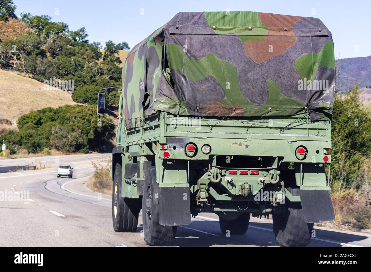 Military vehicle driving on the freeway in South California Stock Photo ...