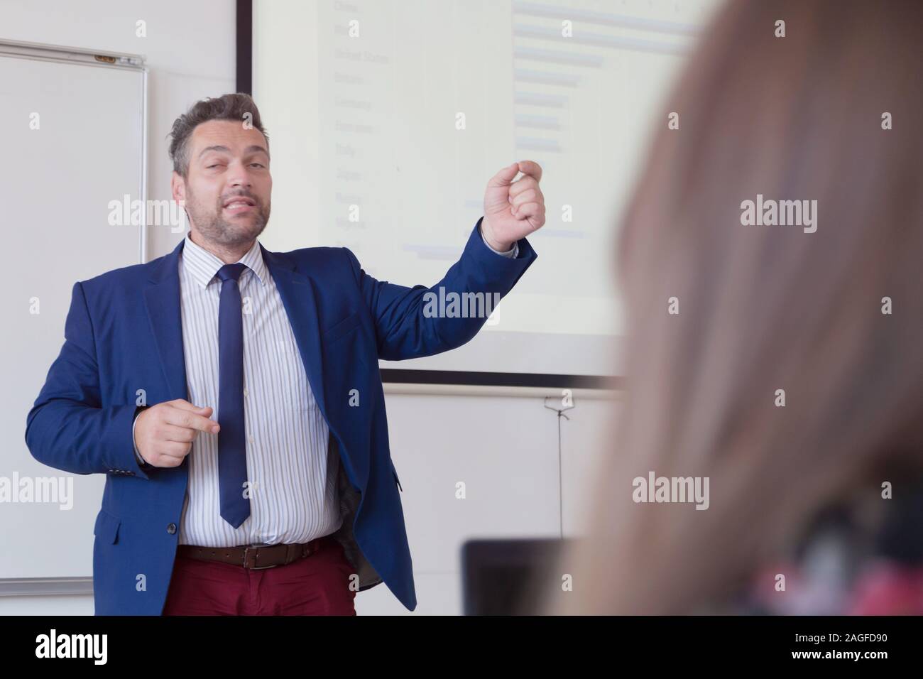Male professor explain lesson to students and interact with them in the ...