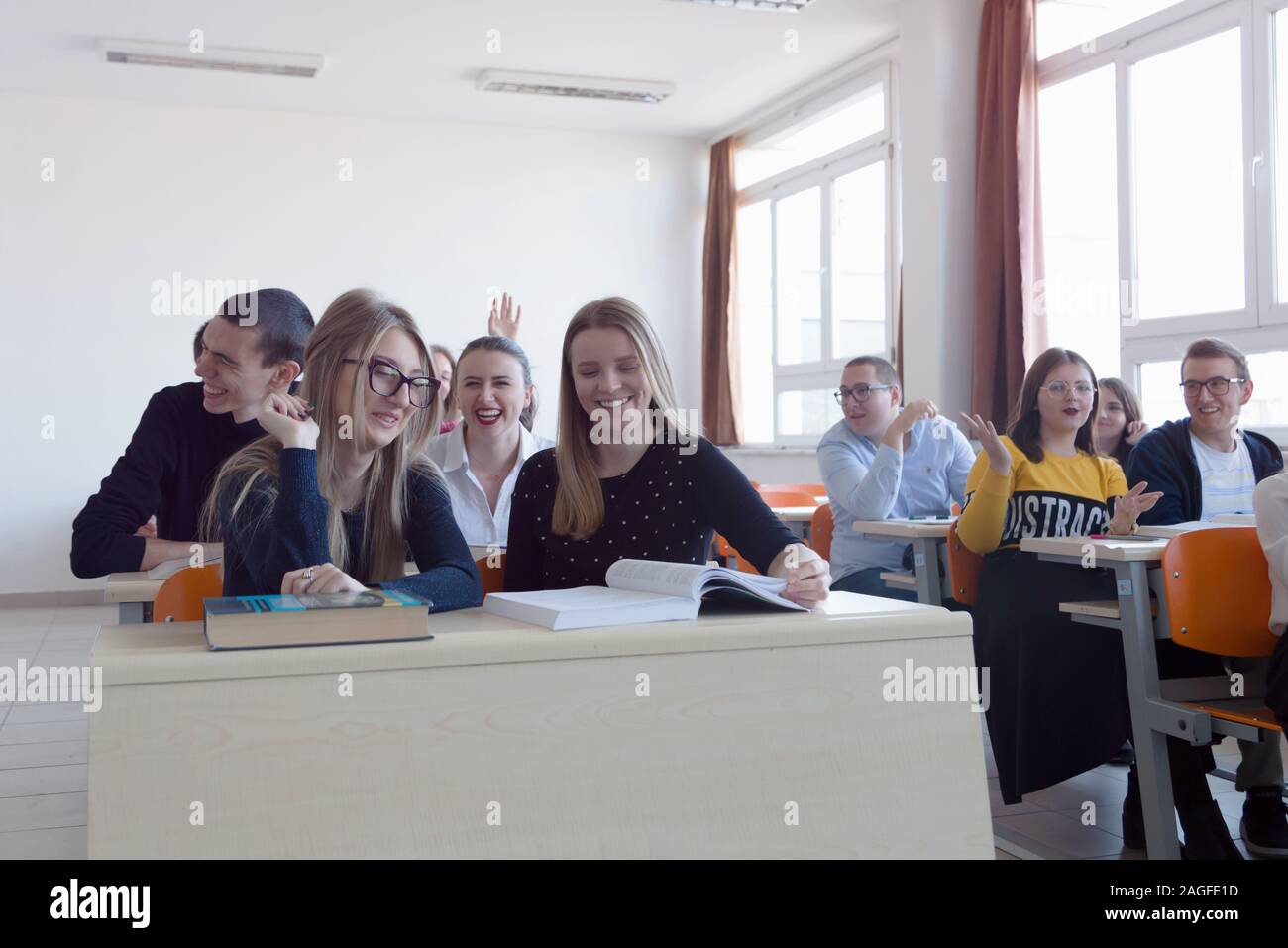 University students listening while Male professor explain lesson to ...