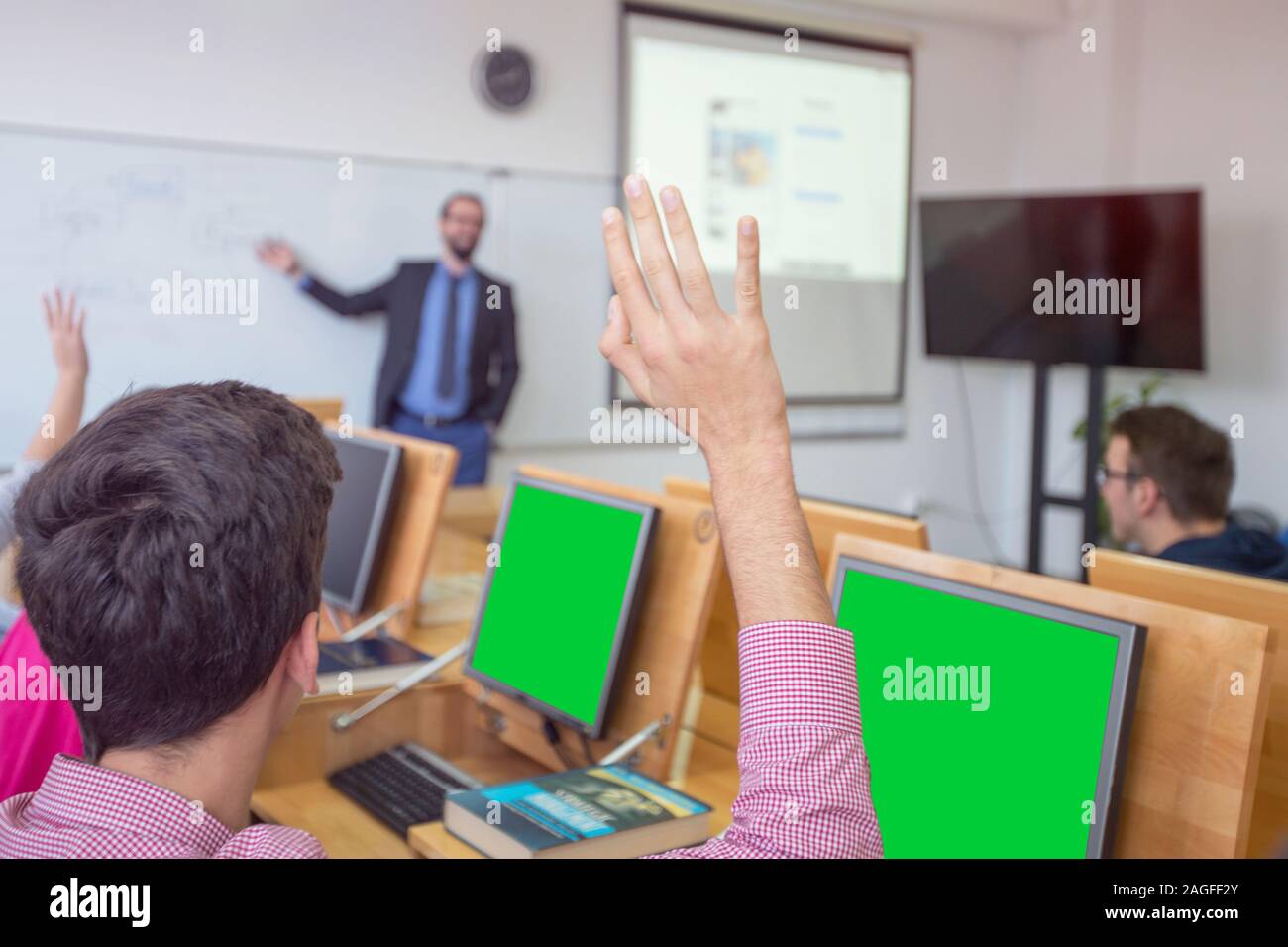 Male professor explain lesson to students and interact with them in the ...