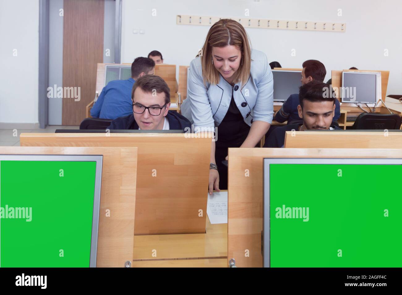 Female attractive professor explain lesson to students and interact ...