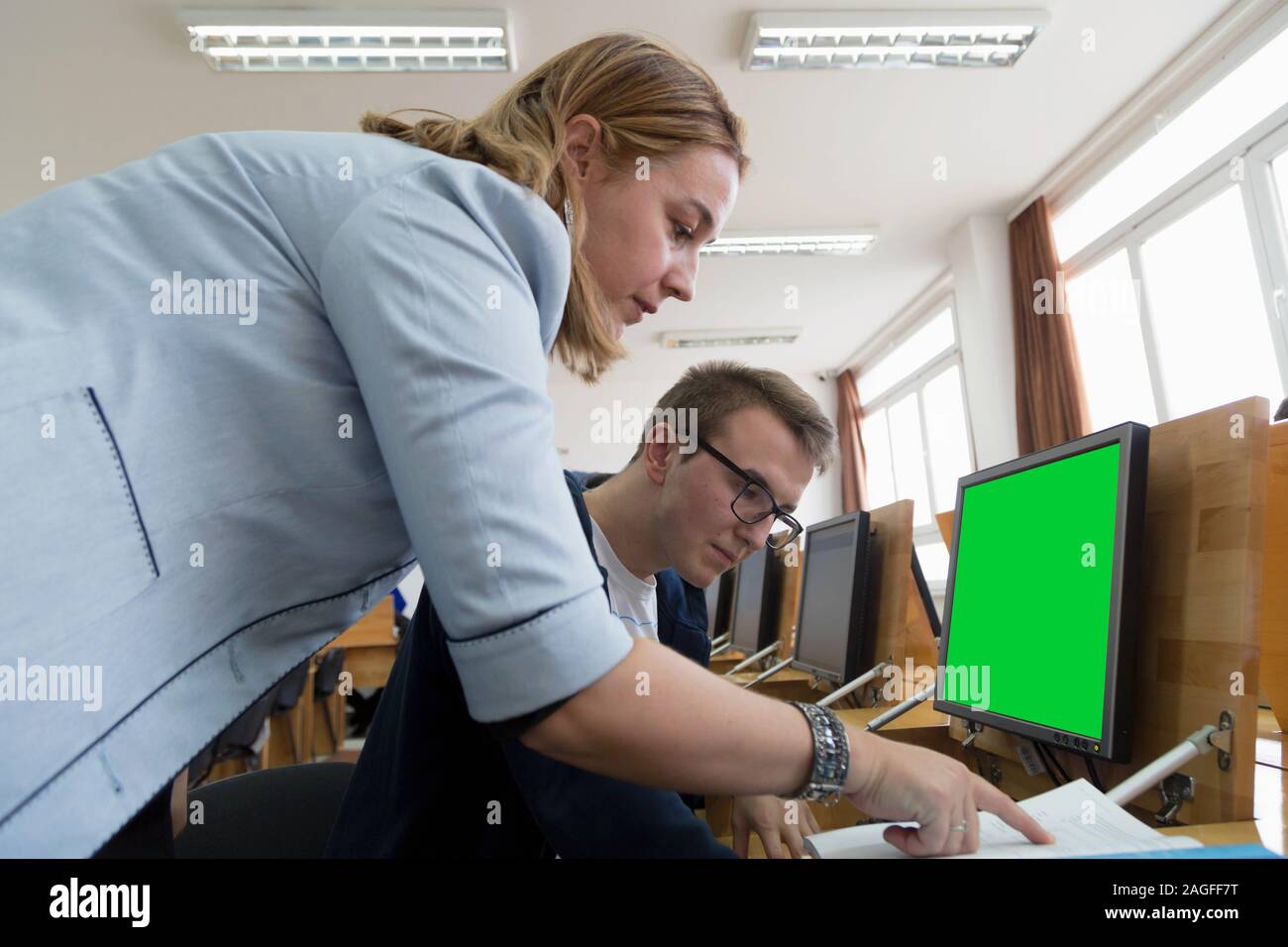 Female attractive professor explain lesson to students and interact ...