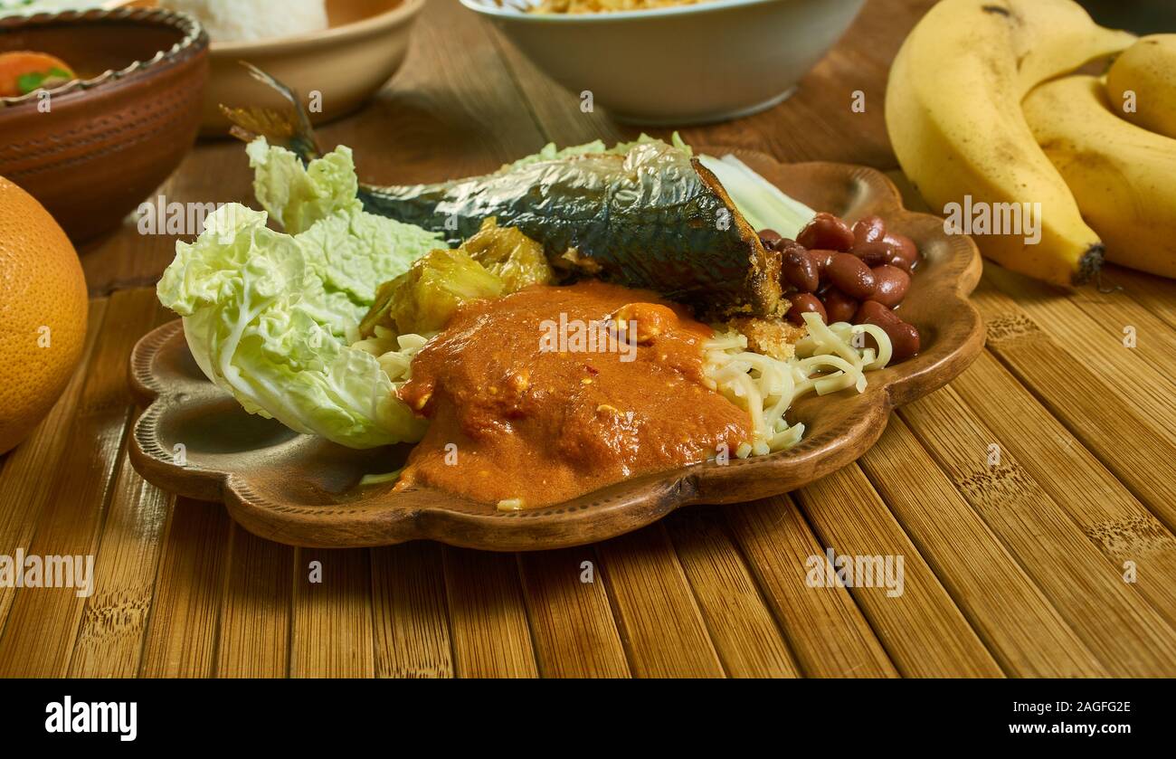 Kenkey with fried fish and chili pepper, Ghanaian cuisine, Traditional ...