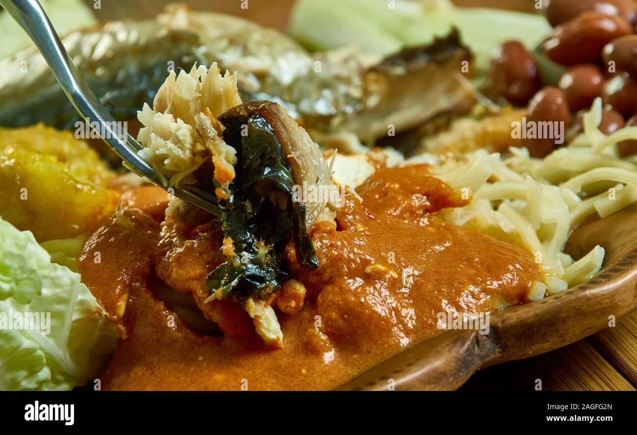 Kenkey with fried fish and chili pepper, Ghanaian cuisine, Traditional assorted African dishes ...