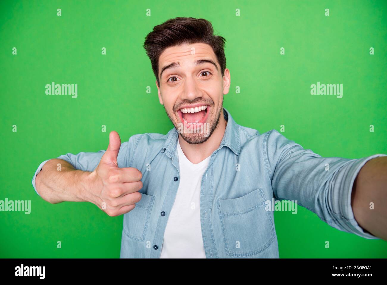 Photo of cheerful positive attractive ecstatic man at leisure showing ...